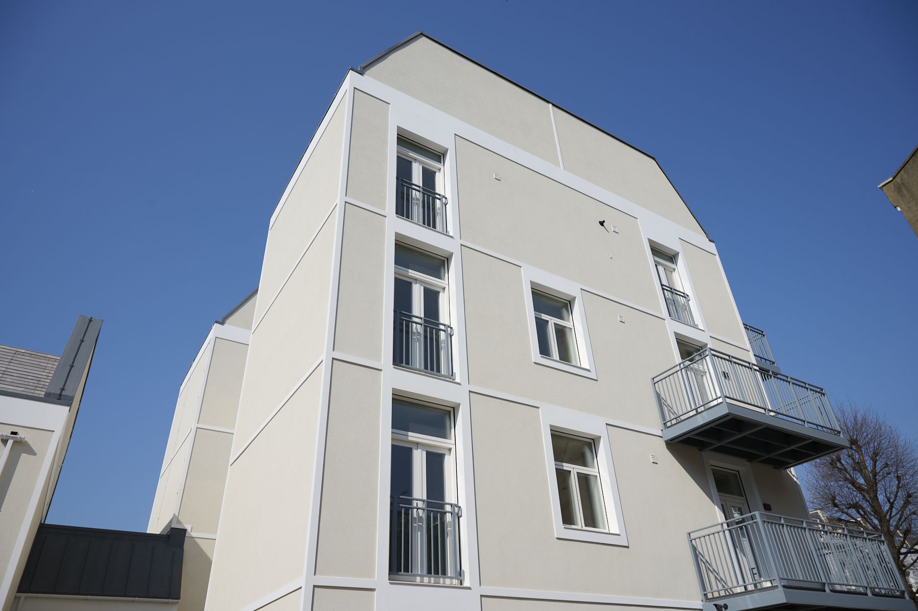 Sto brings colour and detailing to new housing development | Roofing ...